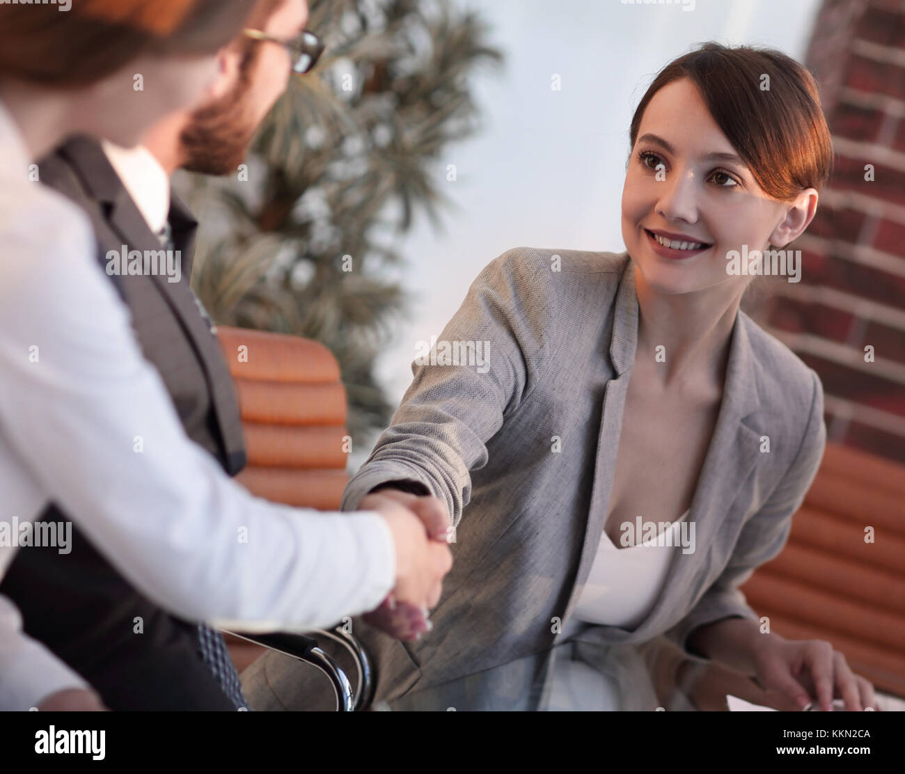 business woman greets the employee with a handshake Stock Photo - Alamy