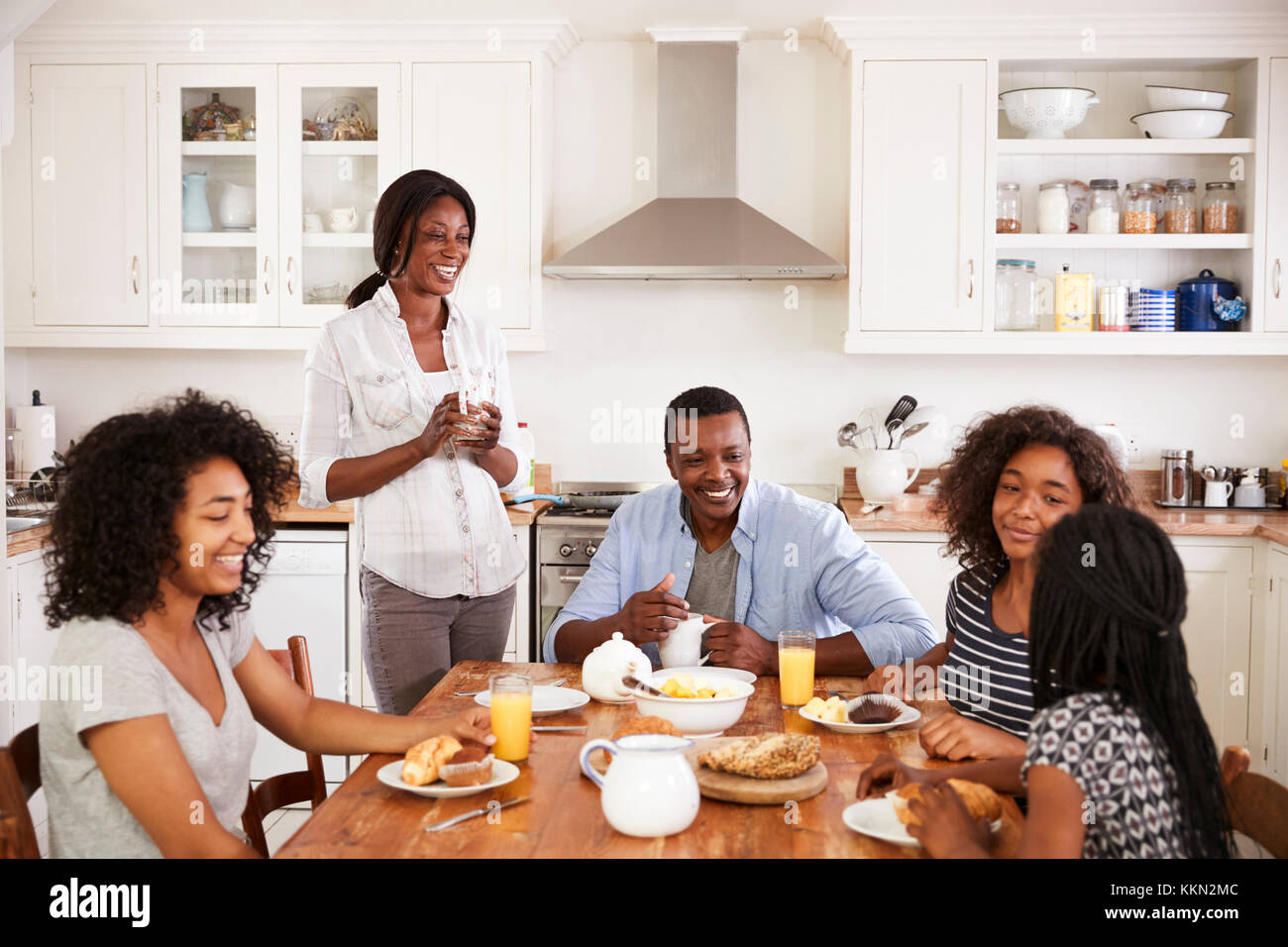 Family With Teenage Children Eating Breakfast In Kitchen Stock Photo ...