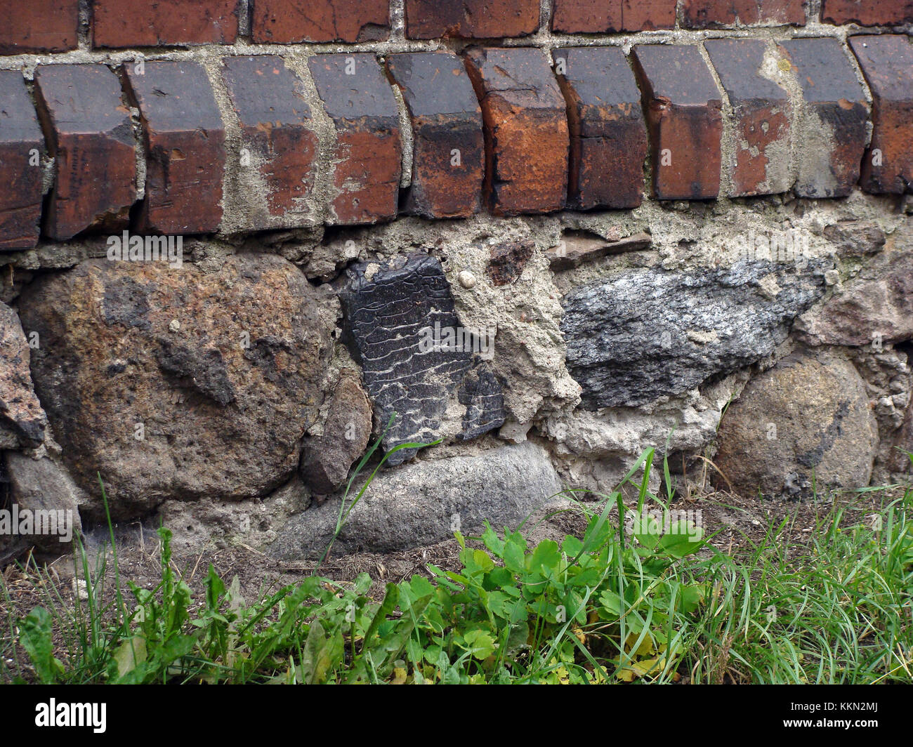 Retro stone foundation of red brick house close up Stock Photo - Alamy