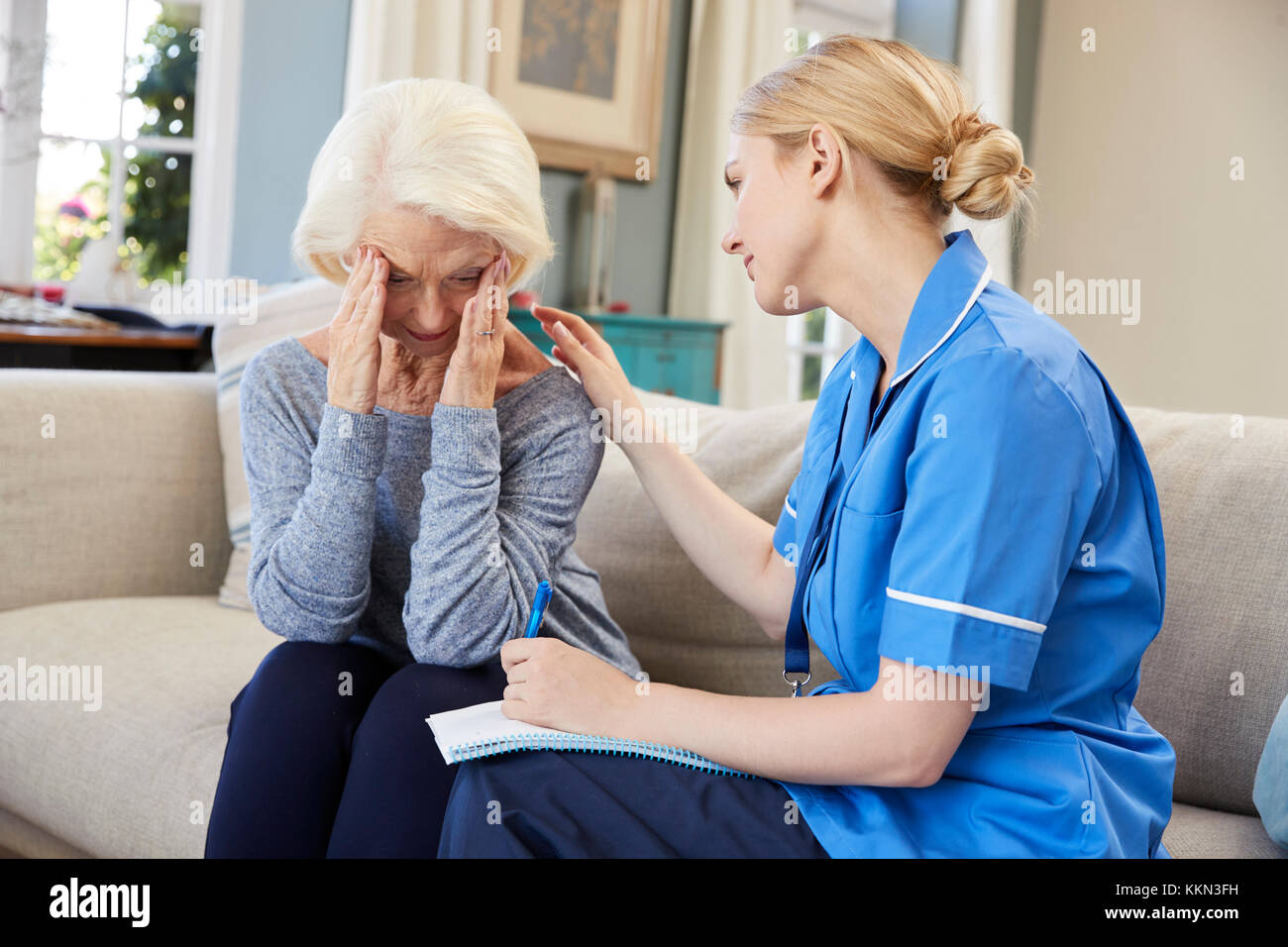 Community Nurse Visits Senior Woman Suffering With Depression Stock ...