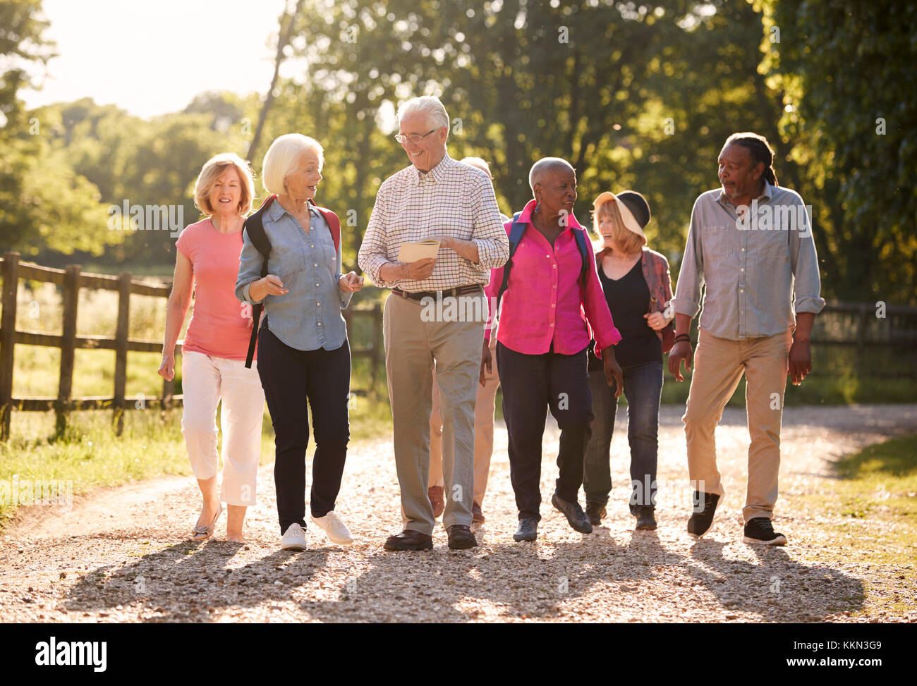 Group Of Senior Friends Hiking In Countryside Stock Photo - Alamy