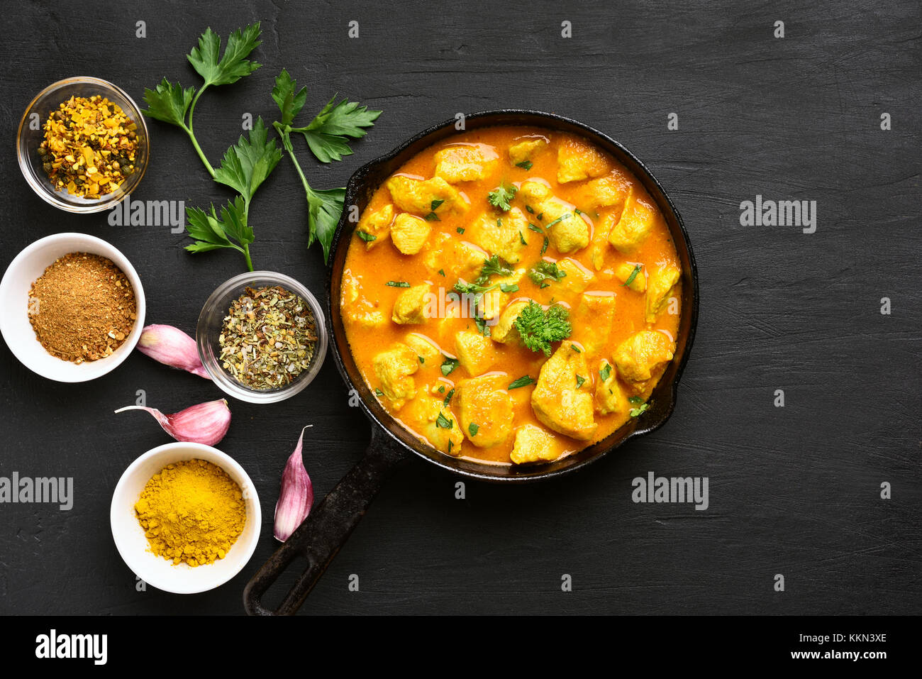 Chicken curry on dark stone background. Top view, flat lay Stock Photo ...