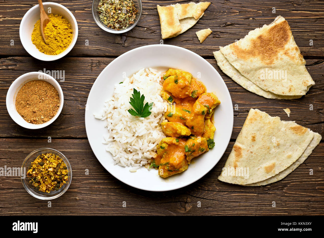 Delicious chicken curry with rice on wooden background. Top view, flat ...