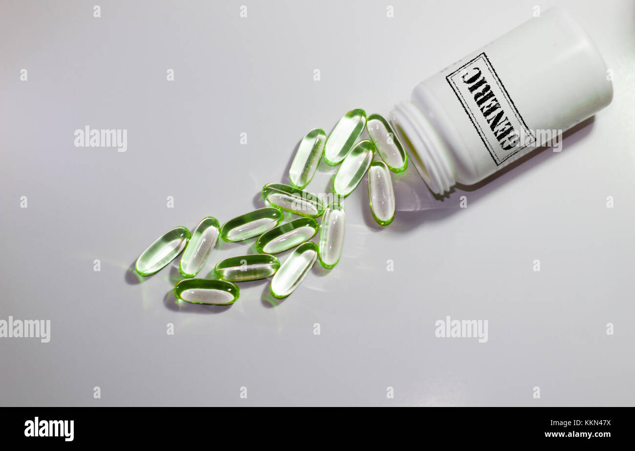pills on a white background and a bottle with the rubber stamp word ...