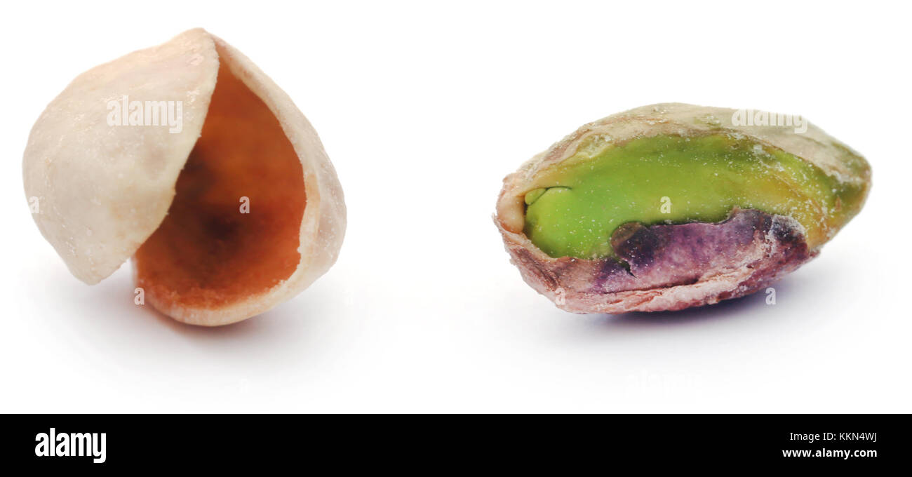Closeup of fresh organic pistachio over white background Stock Photo ...