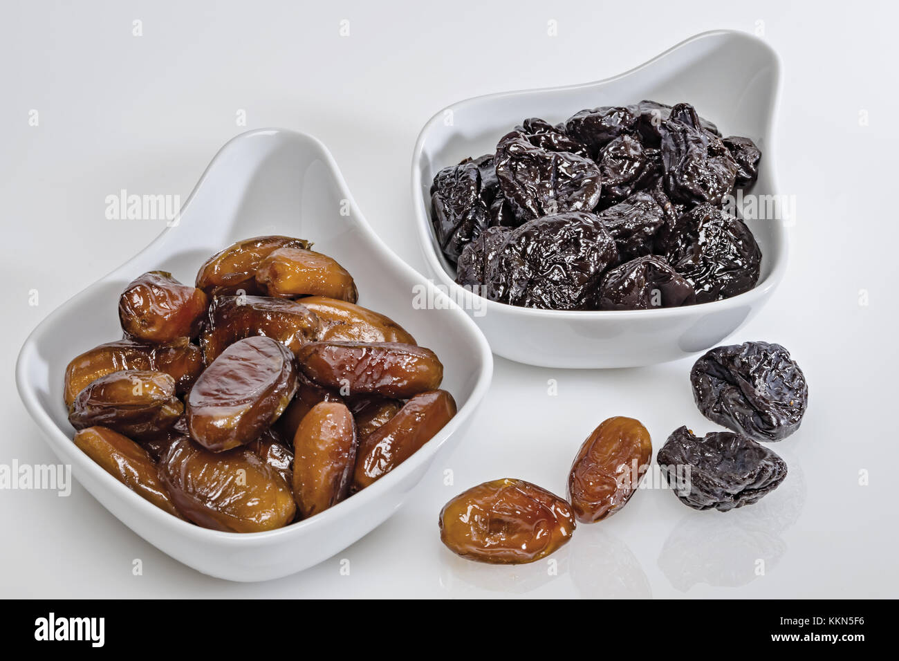 dates plums white background 3 Stock Photo - Alamy