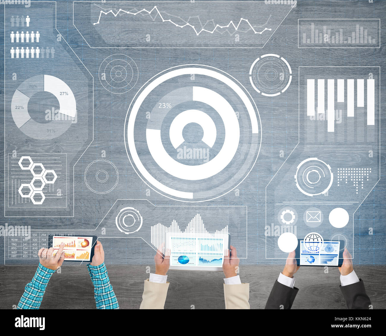 Group of three people with devices in hands working together as symbol ...