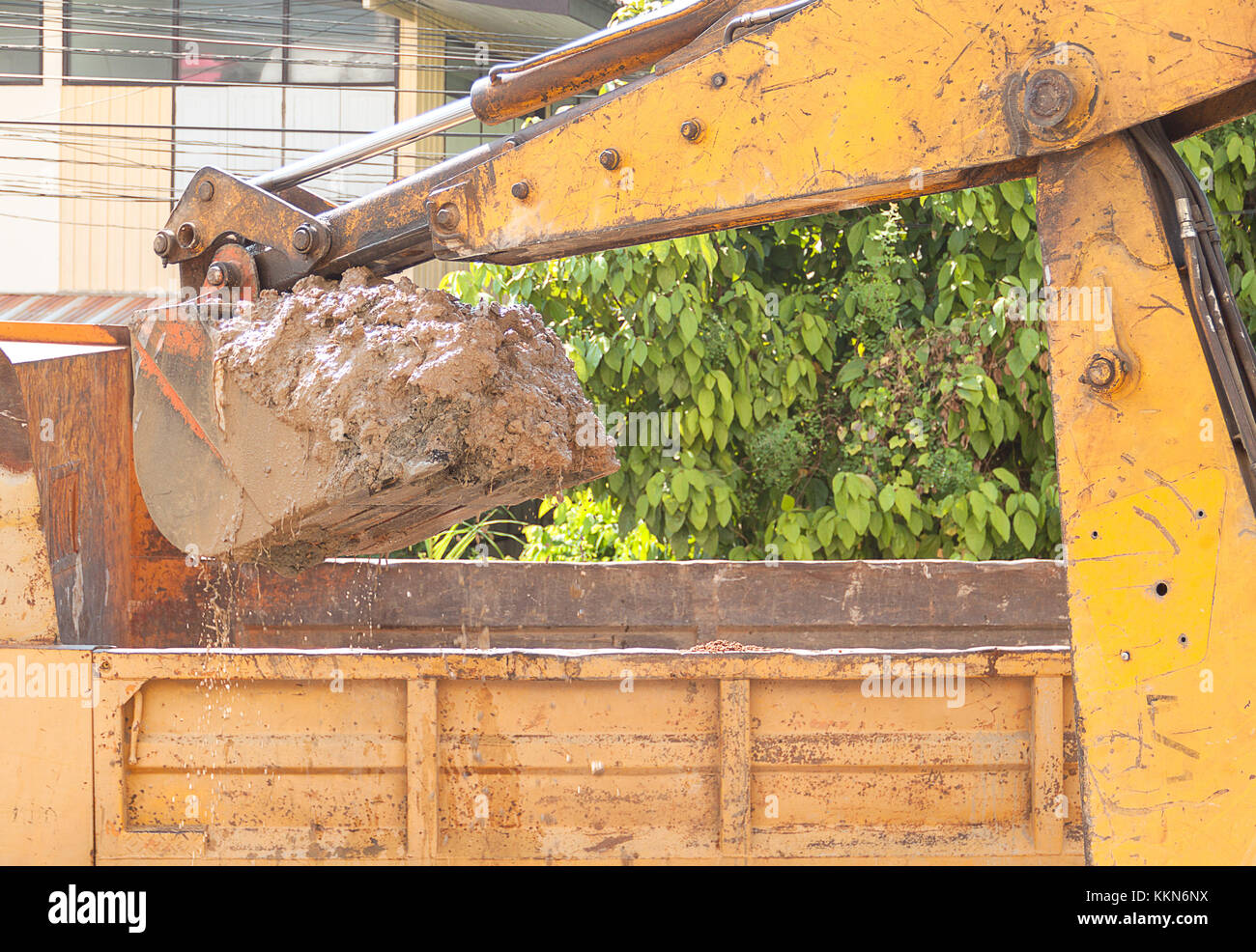 Excavator loading soil body truck hi-res stock photography and images ...
