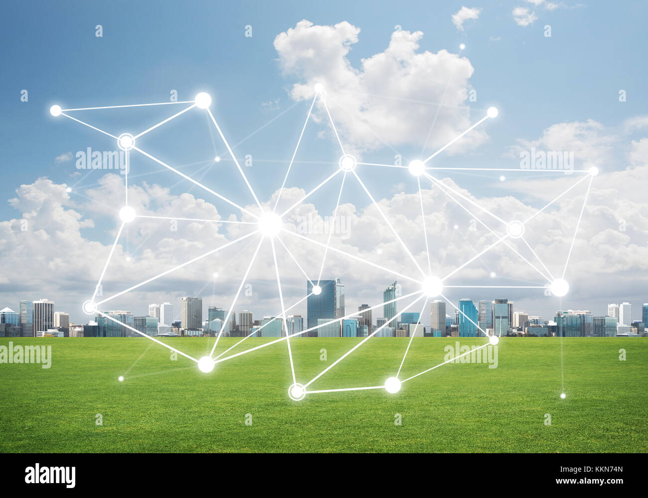 Modern cityscape green grass and social connection concept on screen ...