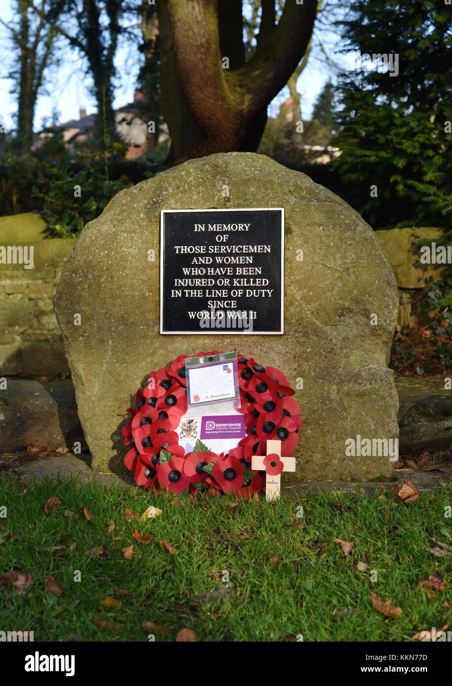 a wreath placed on a memorial stone in High Lea Park, New Mills ...