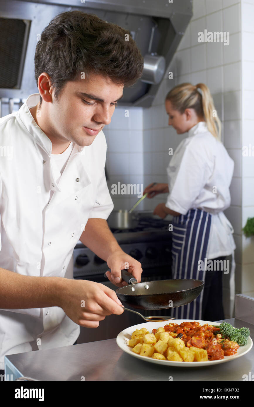 Chef Working In Restaurant Kitchen Stock Photo - Alamy