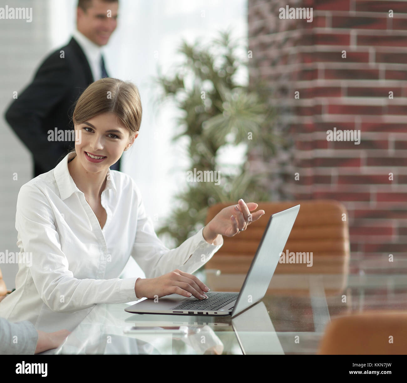 young female Manager working on laptop Stock Photo - Alamy