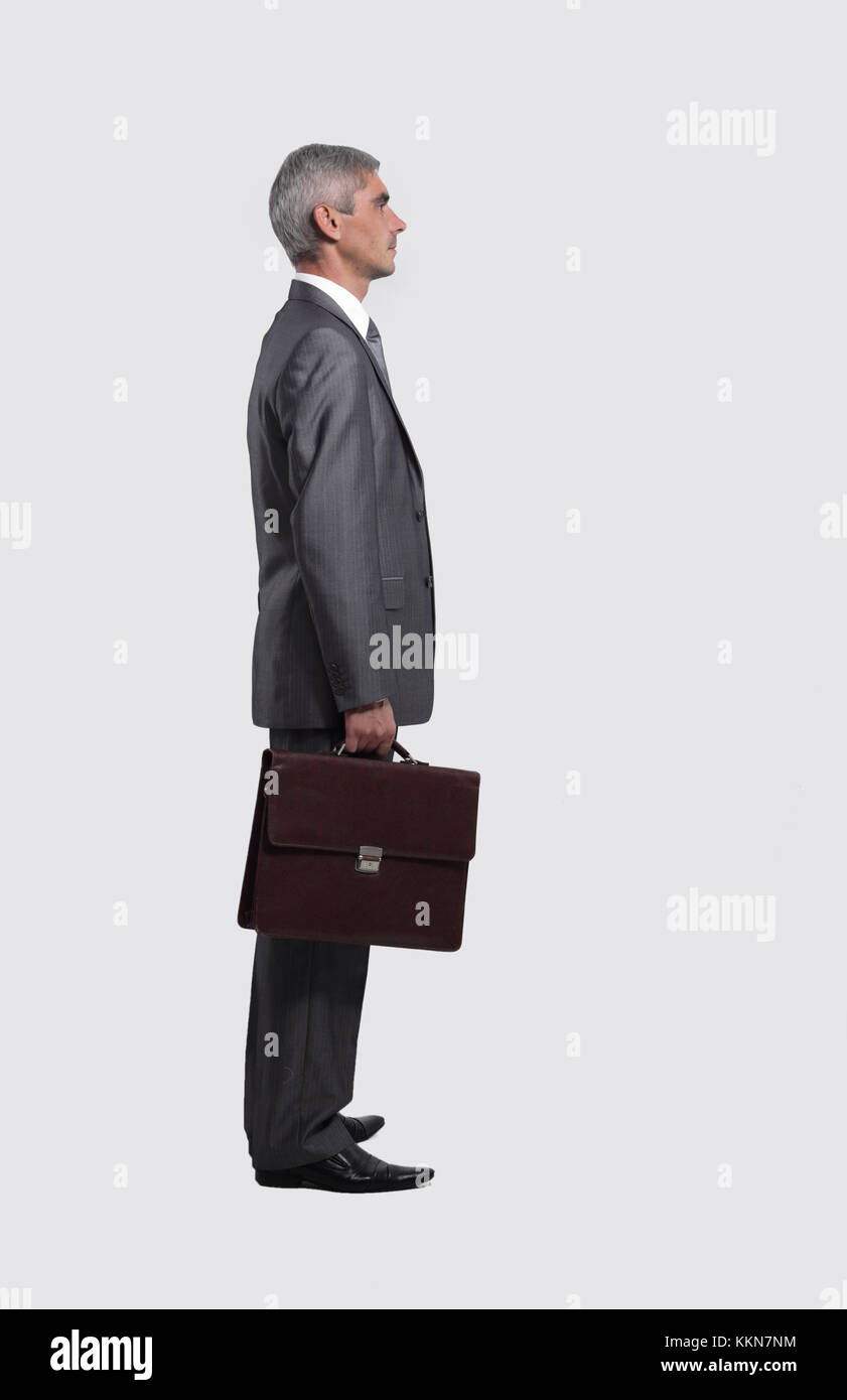 side view.confident businessman with briefcase Stock Photo - Alamy