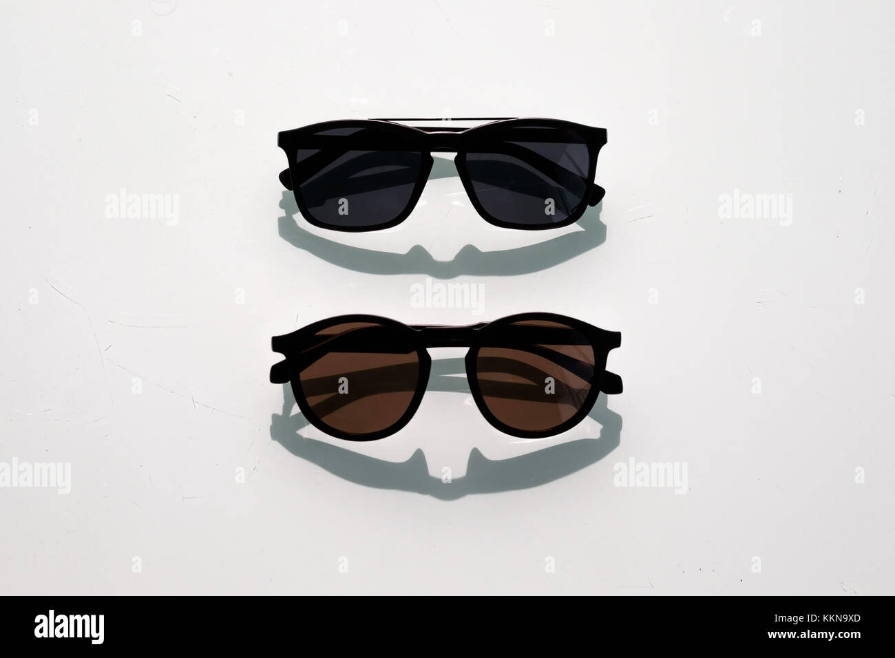 Two black sunglasses on white background Stock Photo - Alamy