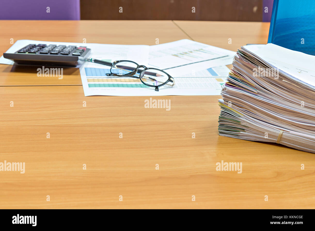Documents and report paper on office wooden desk Stock Photo - Alamy