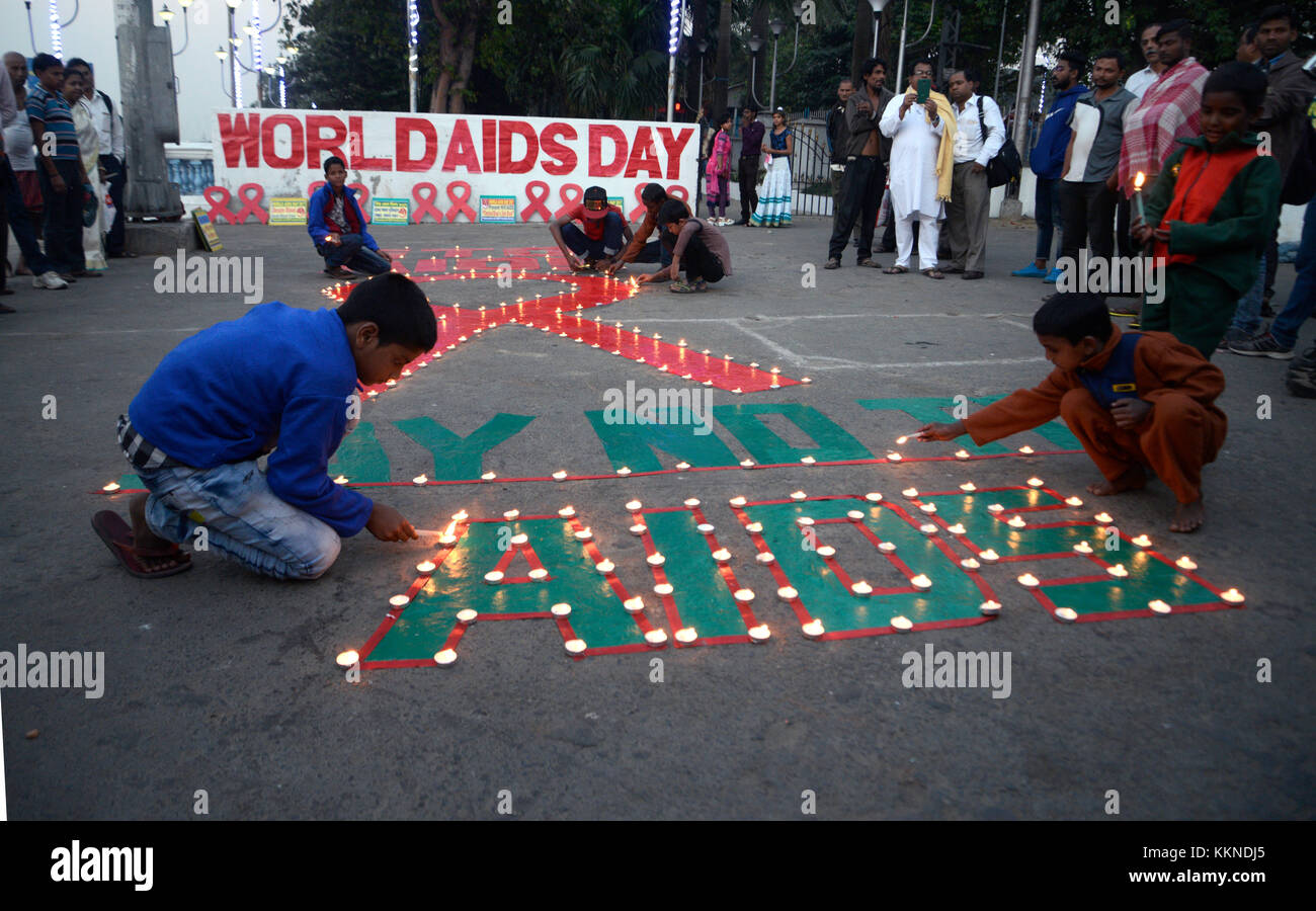 Kolkata, India. 01st Dec, 2017. Children lit lamps on Red Ribbon and ...