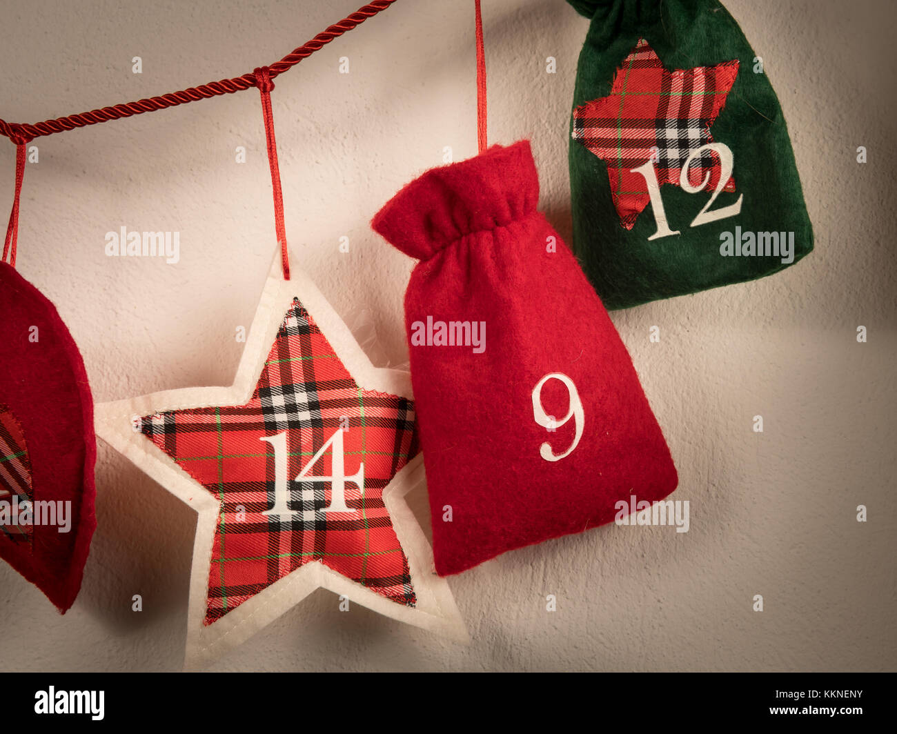Closeup of an advent calendar made of bags hanging on a string Stock ...