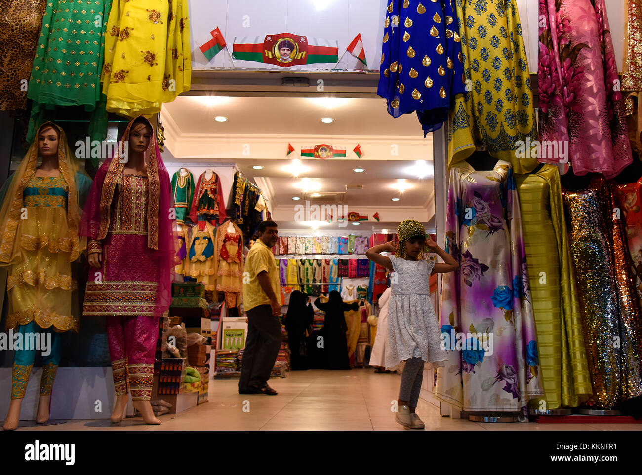 Oman Muscat Mutrah Souk A shop selling cloth and embroidered borders ...