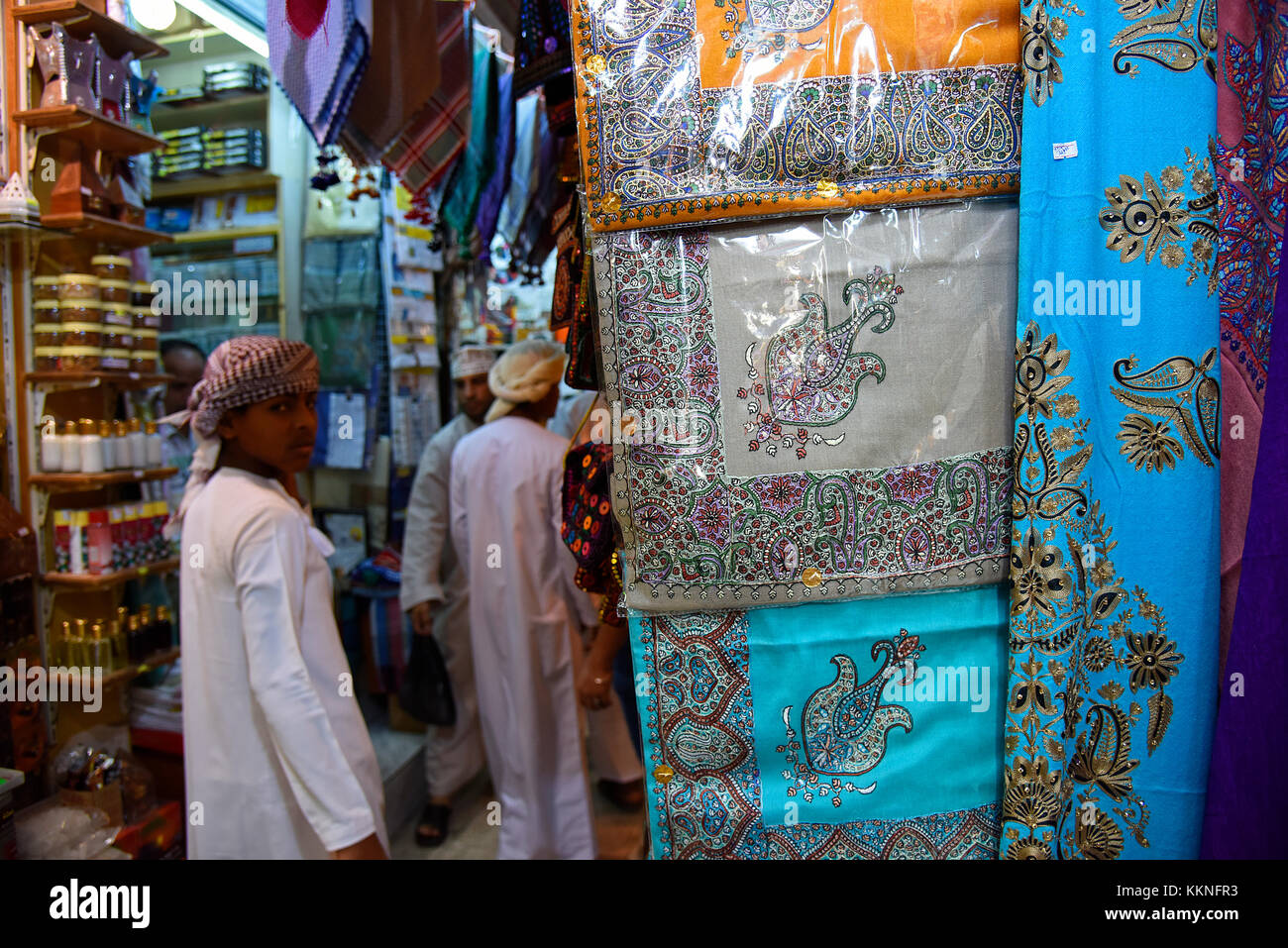 Oman Muscat Mutrah Souk A shop selling cloth and embroidered borders ...