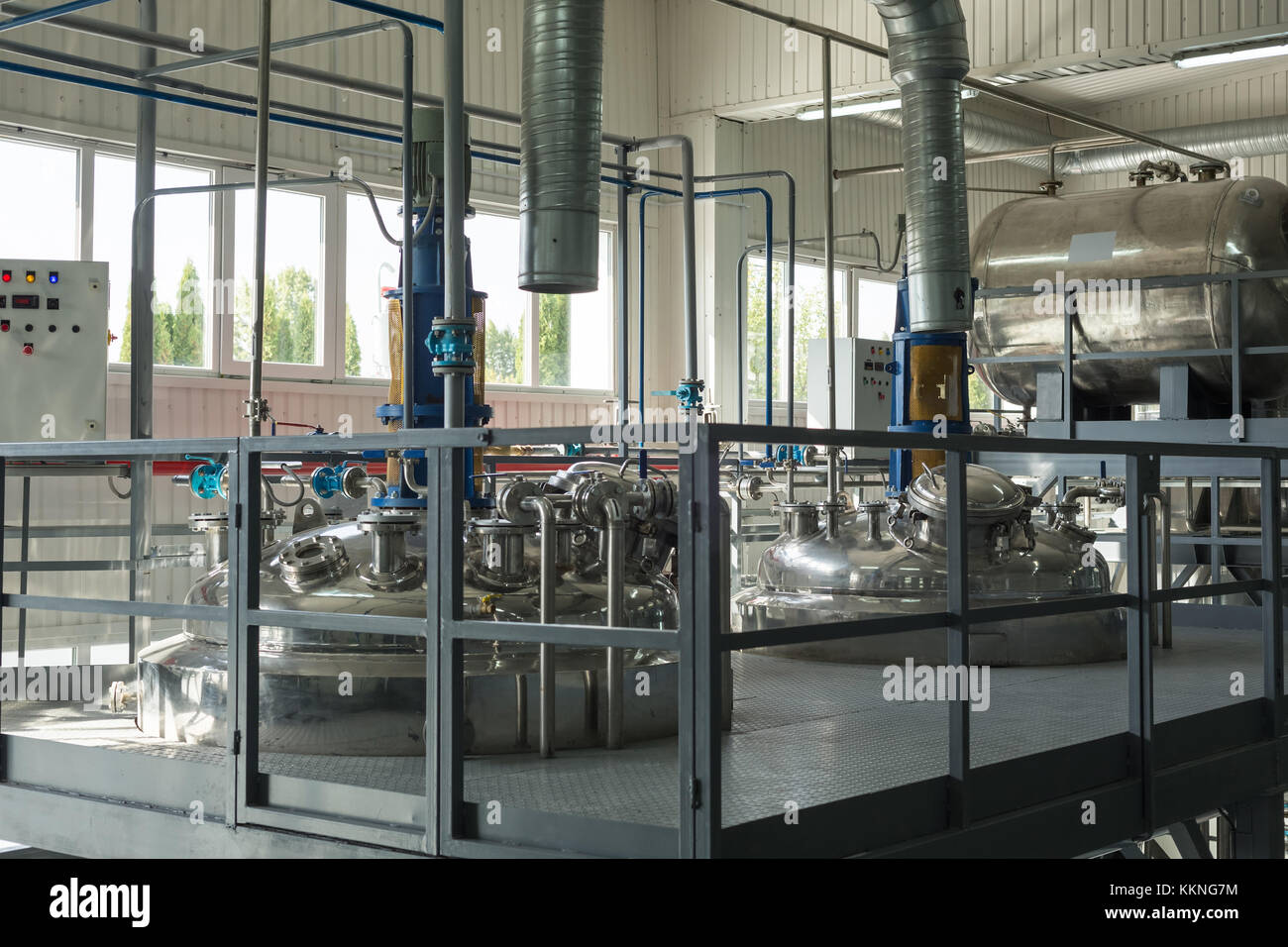 Tanks for chemical mixing on chemical plant. Concept: Manufacturing ...