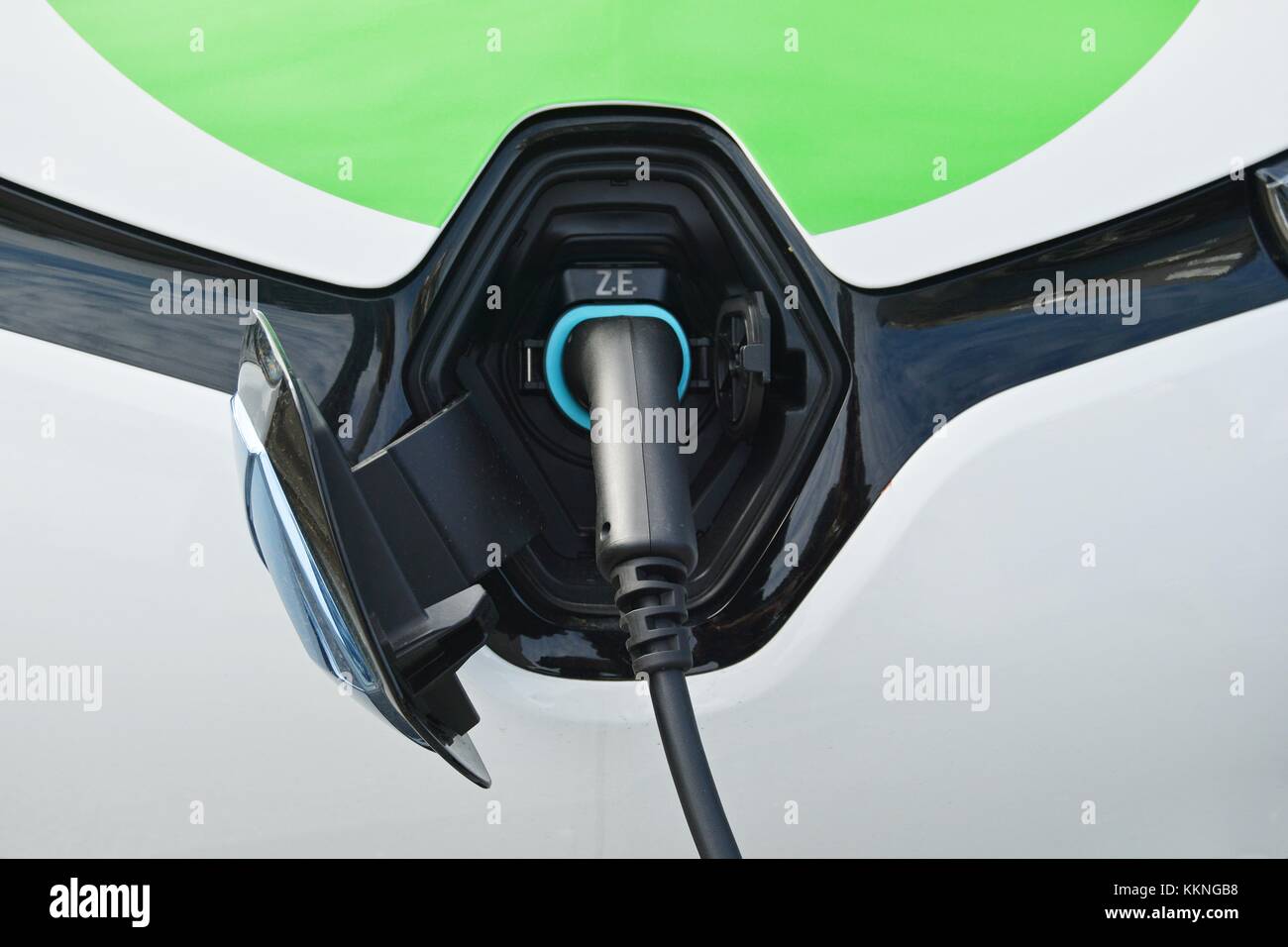 Close-up power supply connected to an electric car to add a charge to ...