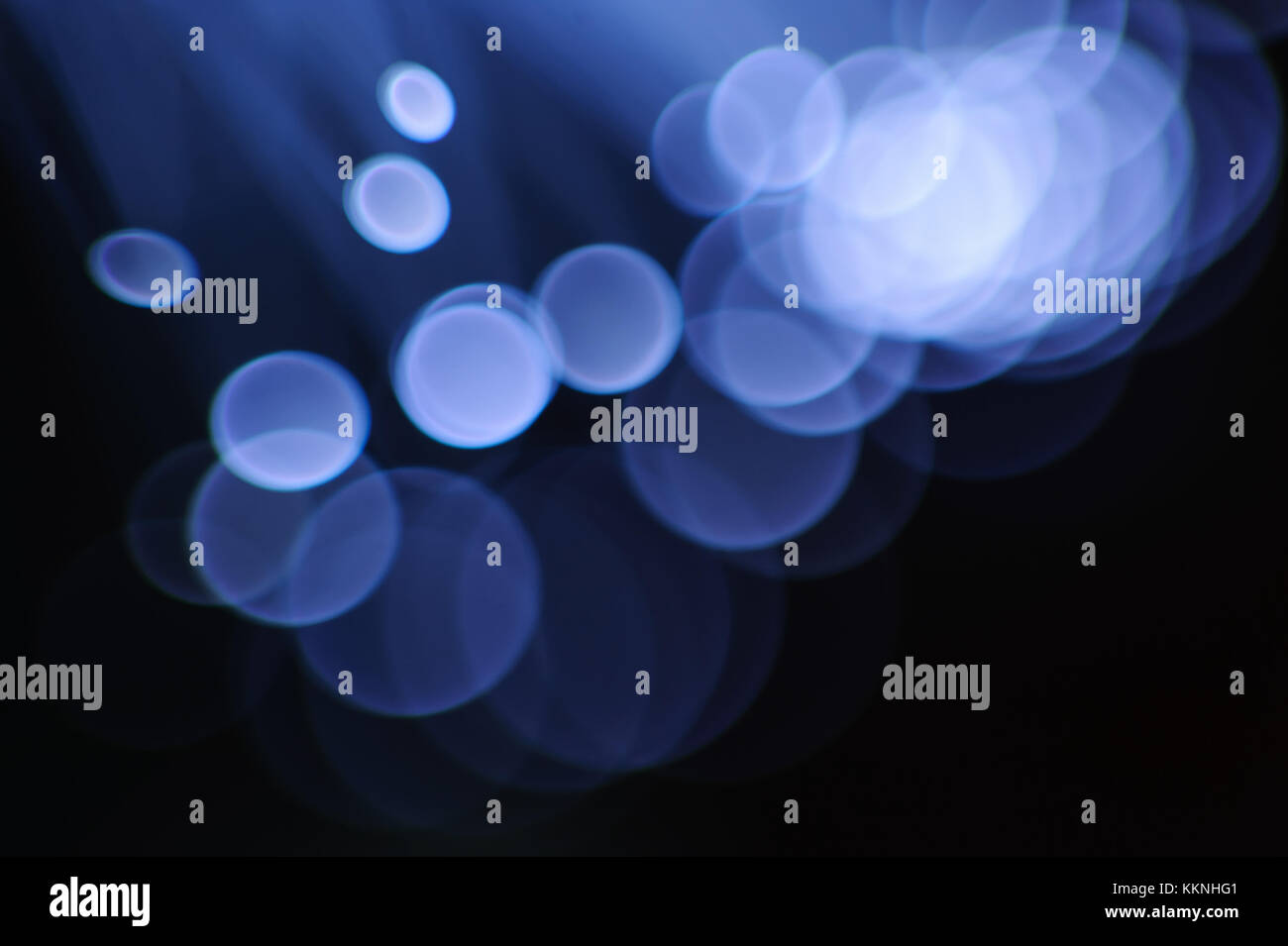 Abstract blue flashing lights on a dark background Stock Photo - Alamy