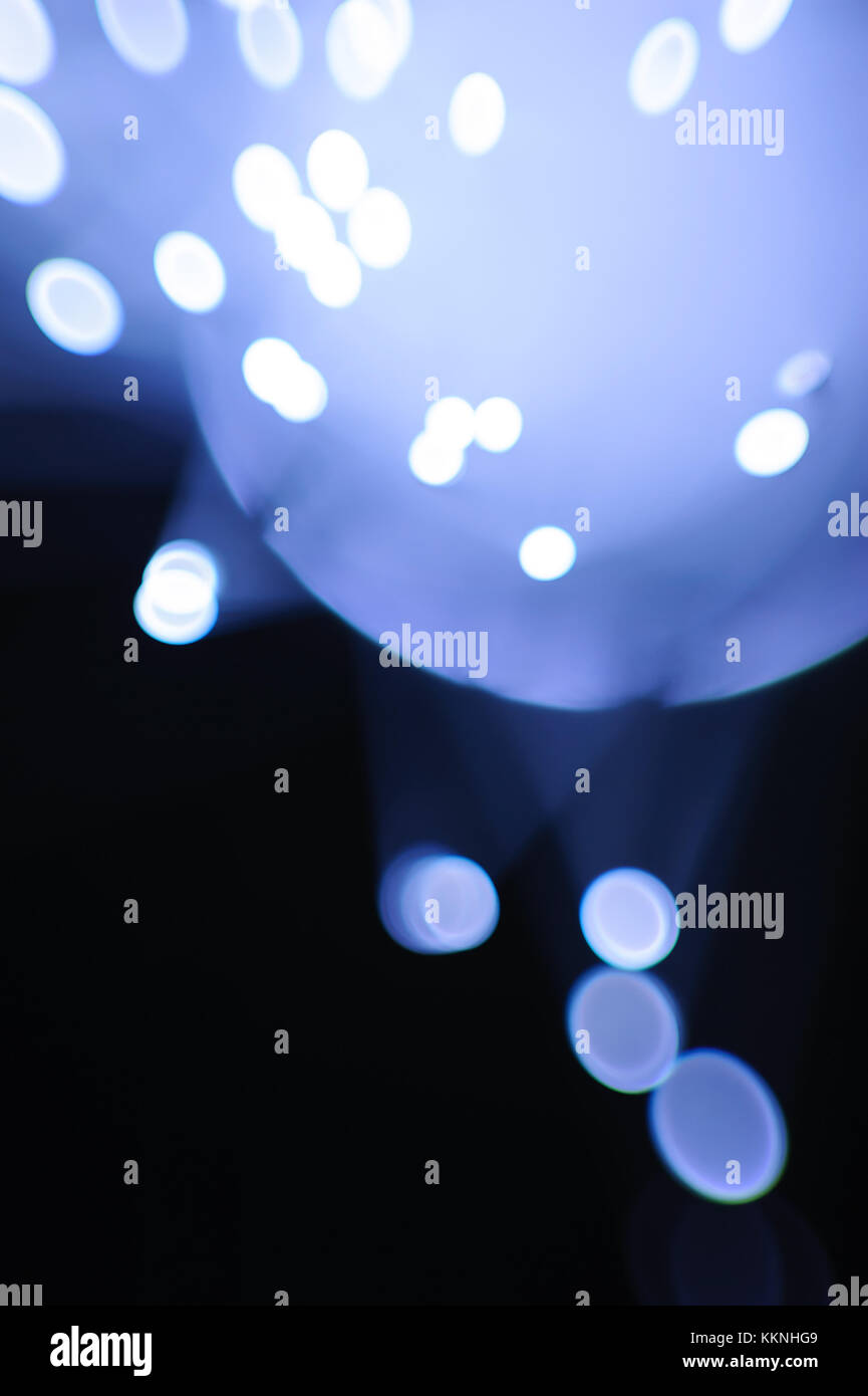 Abstract blue flashing lights on a dark background Stock Photo - Alamy
