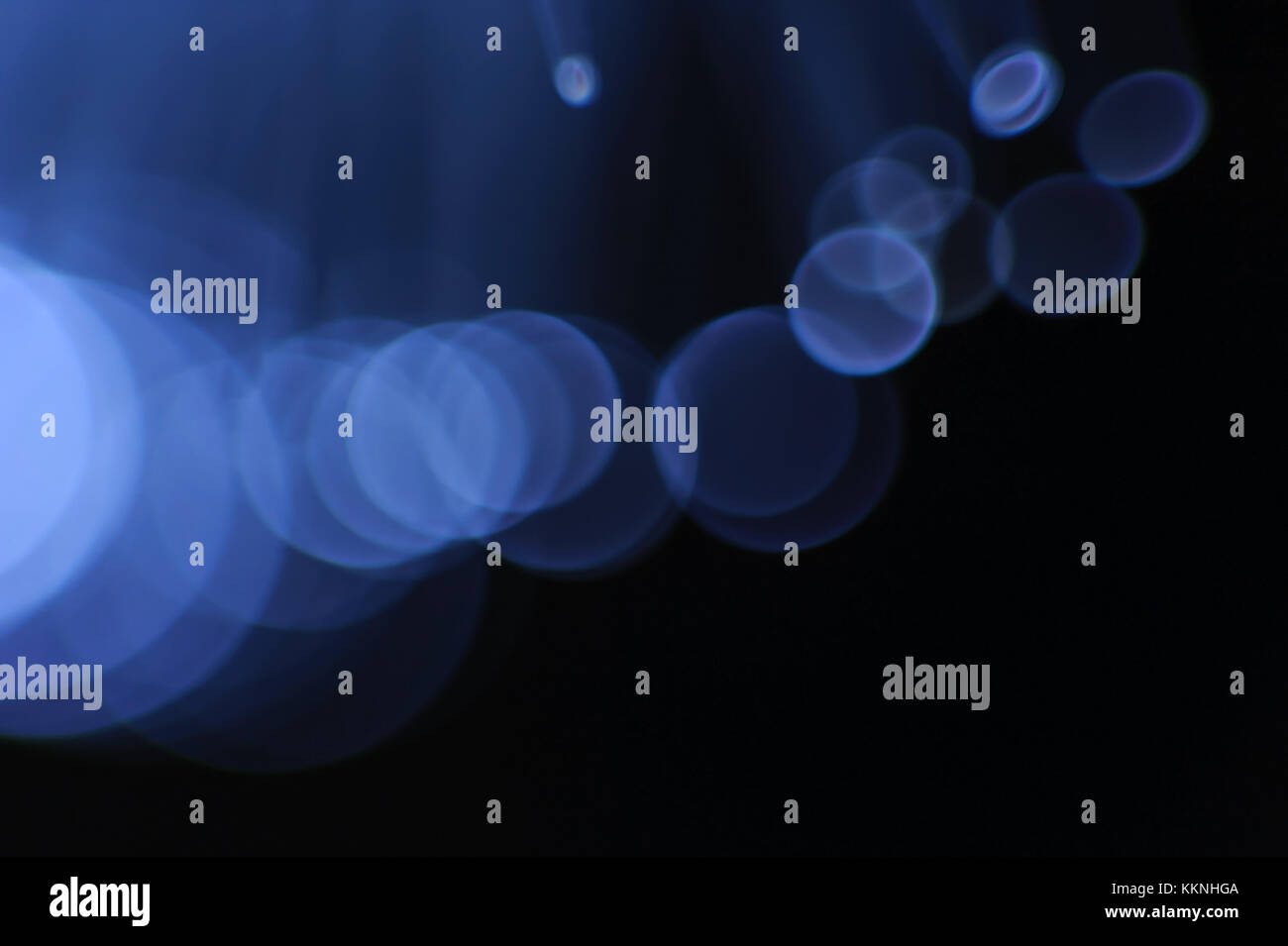 Abstract blue flashing lights on a dark background Stock Photo - Alamy