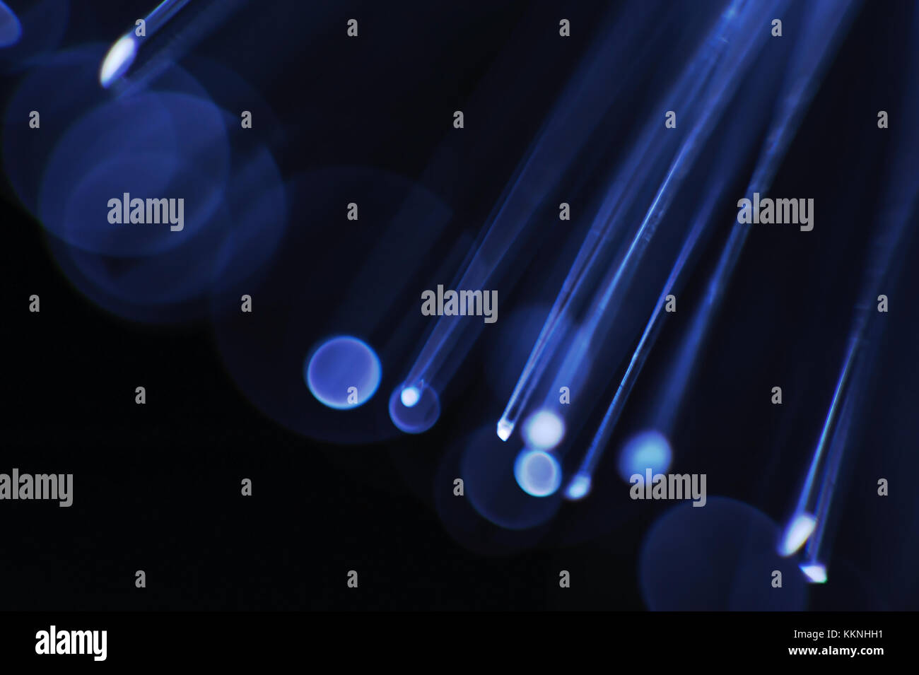 Abstract blue flashing lights on a dark background Stock Photo - Alamy