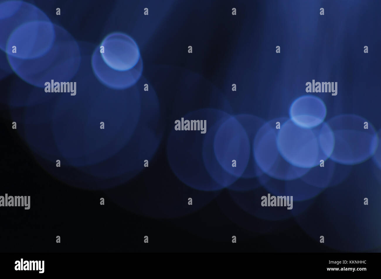Abstract blue flashing lights on a dark background Stock Photo - Alamy