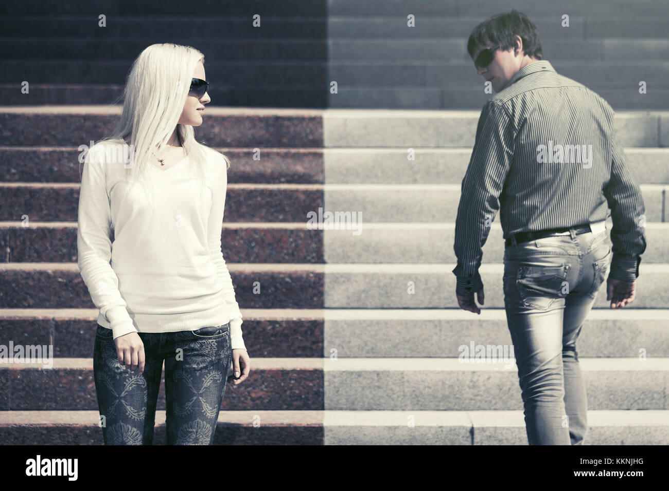 Young fashion man and woman flirting in a city street Stock Photo - Alamy