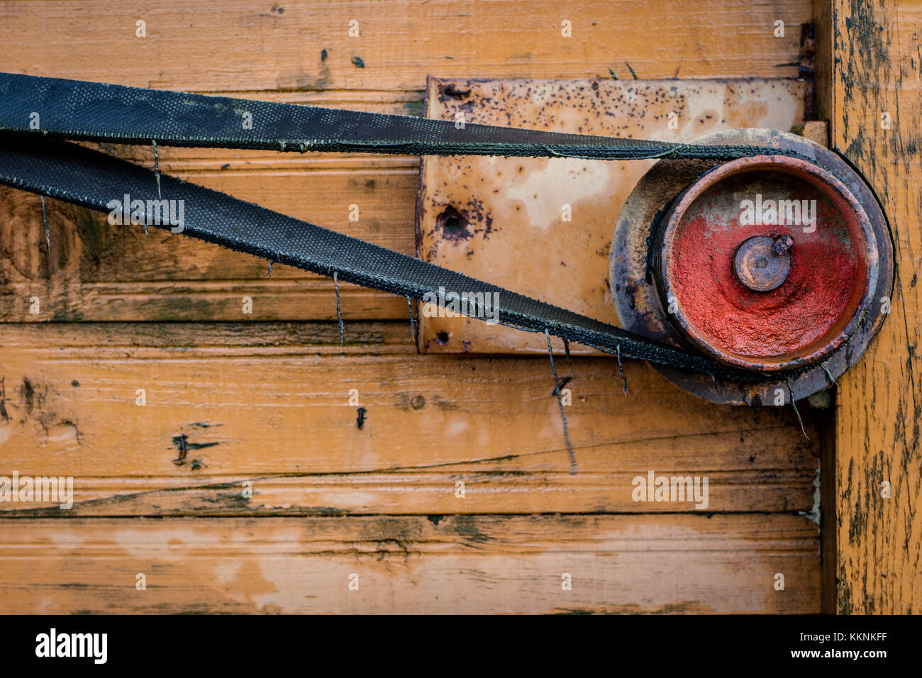 Old pulley in an old agricultural machine. Threshing machine, pulley ...