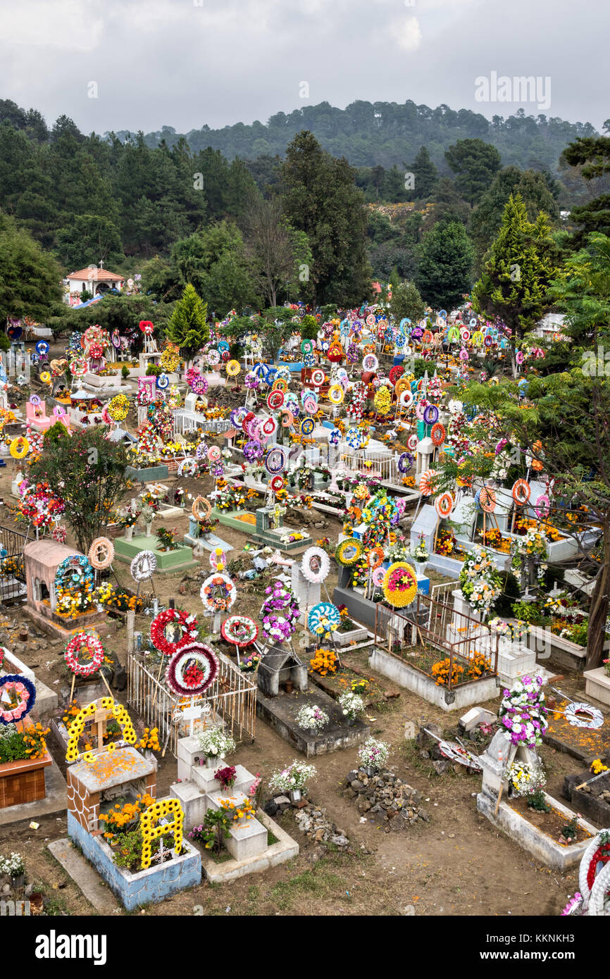 Hundreds of hillside graves decorated with flowers and wreaths for the ...