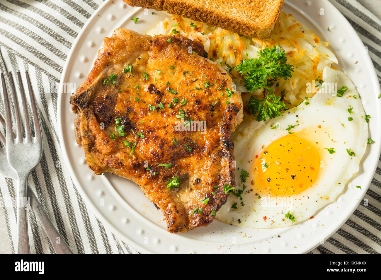 Homemade Fried Breakfast Pork Chops with Eggs and Potatoes Stock Photo ...