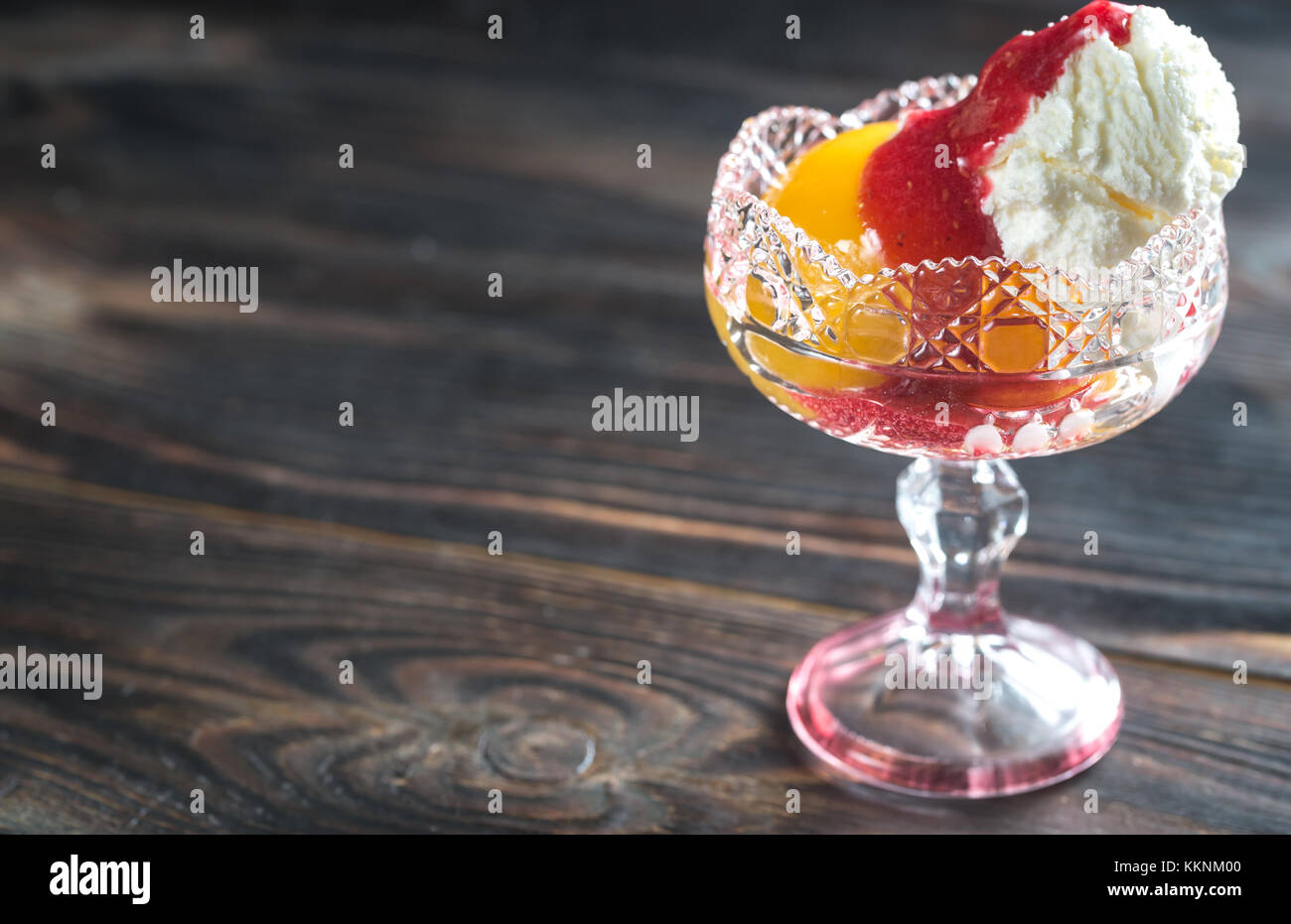 Bowl of Peach Melba - vanilla ice cream with peaches and raspberry ...