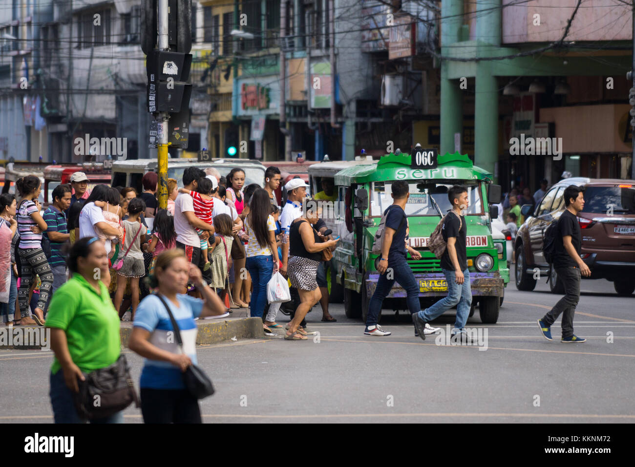 People crossing a busy junction within Cebu City,Philippines Stock ...