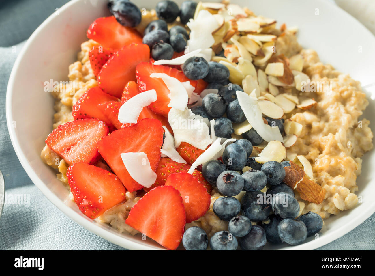 Healthy Fresh Oatmeal with Strawberries Almonds Blueberries and Coconut ...