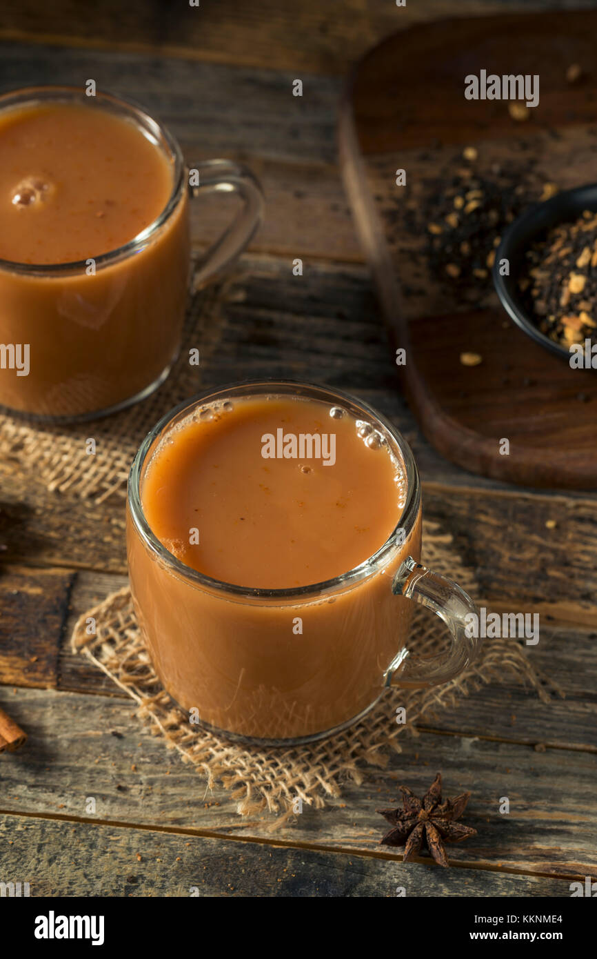 Organic Hot Chai Tea Drink with Milk and Spices Stock Photo - Alamy