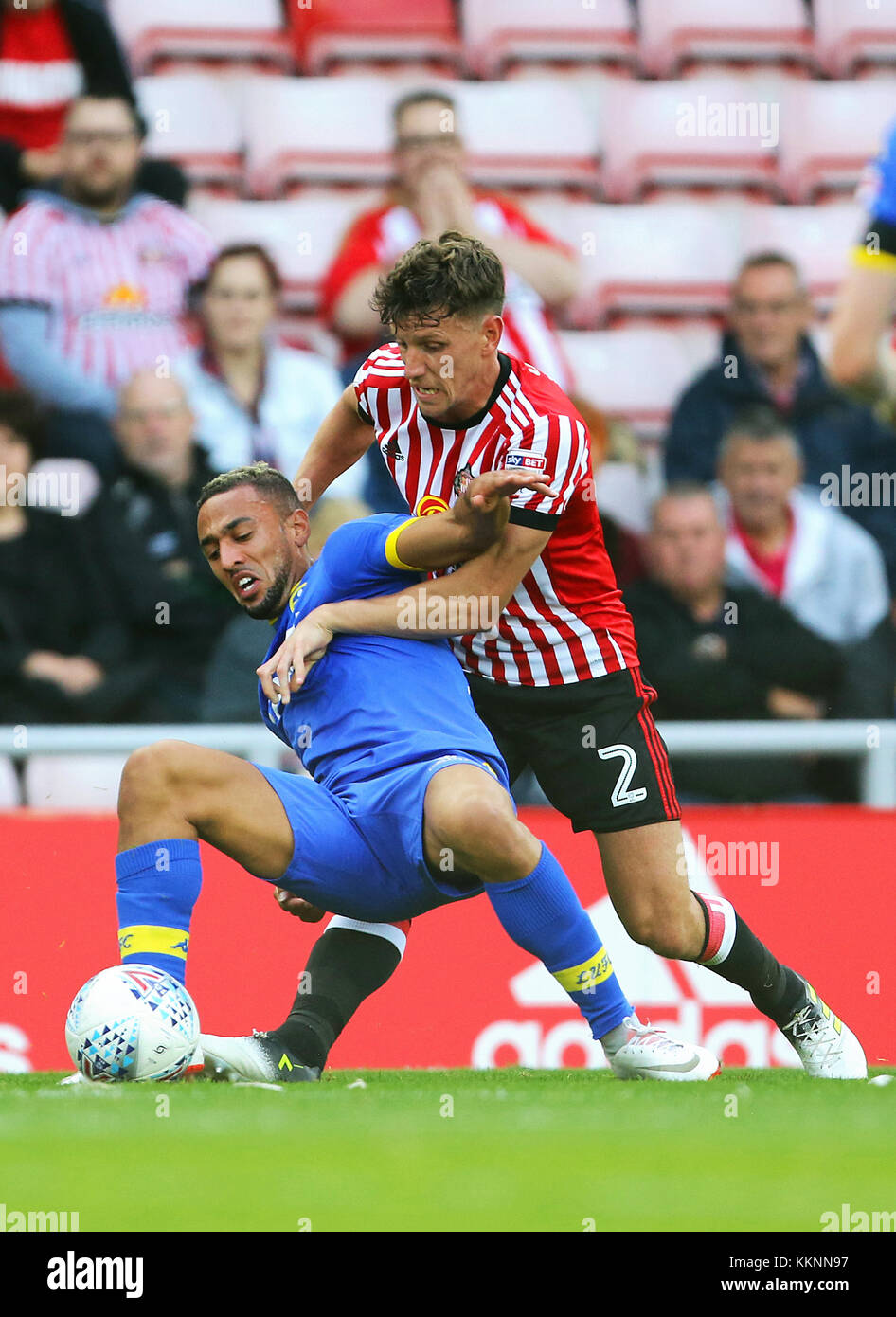 Leeds United's Kemar Roofe (left) and Sunderland's Billy Jones battle ...