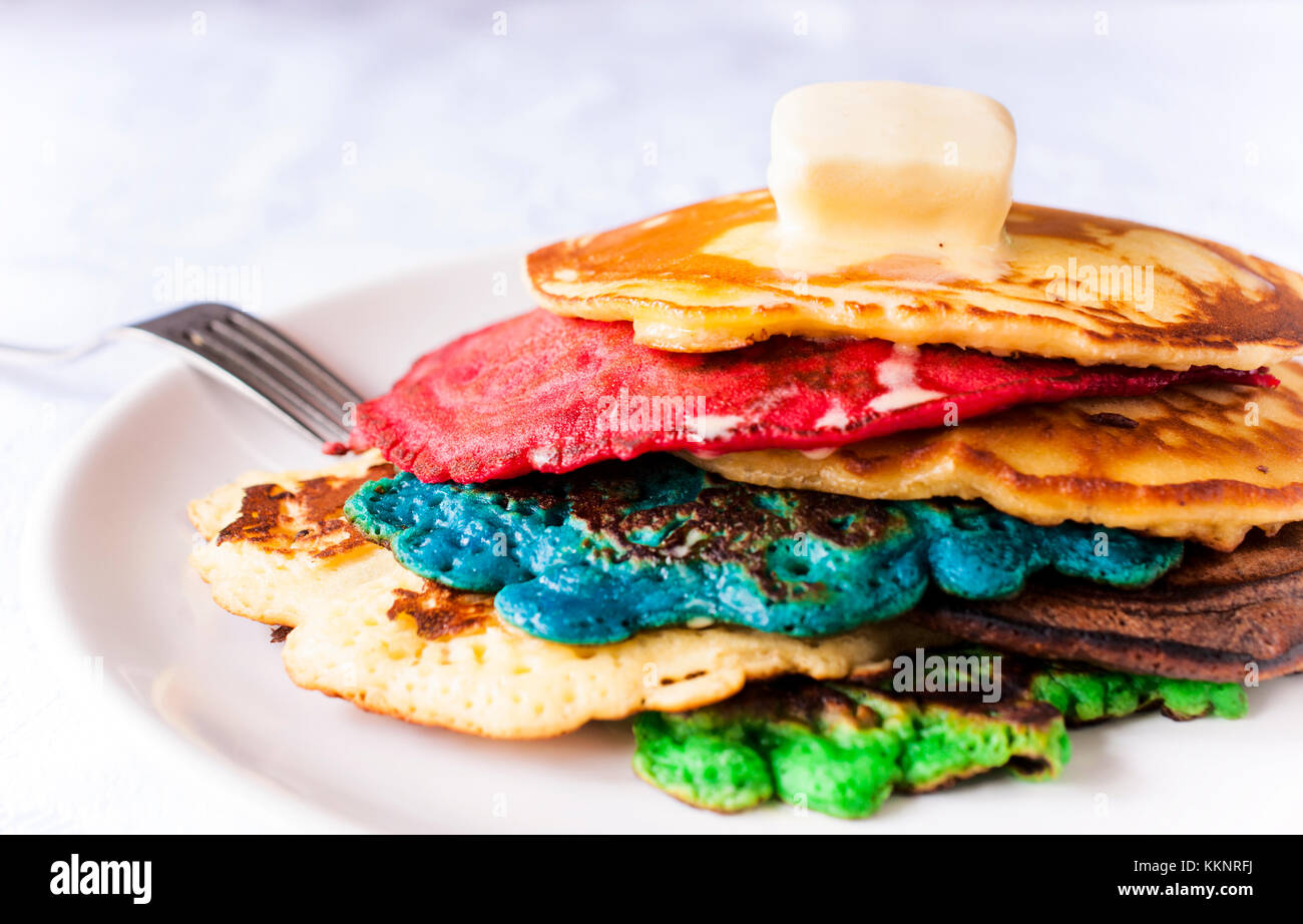 Homemade colorfull pancakes with melted butter on the top Stock Photo ...