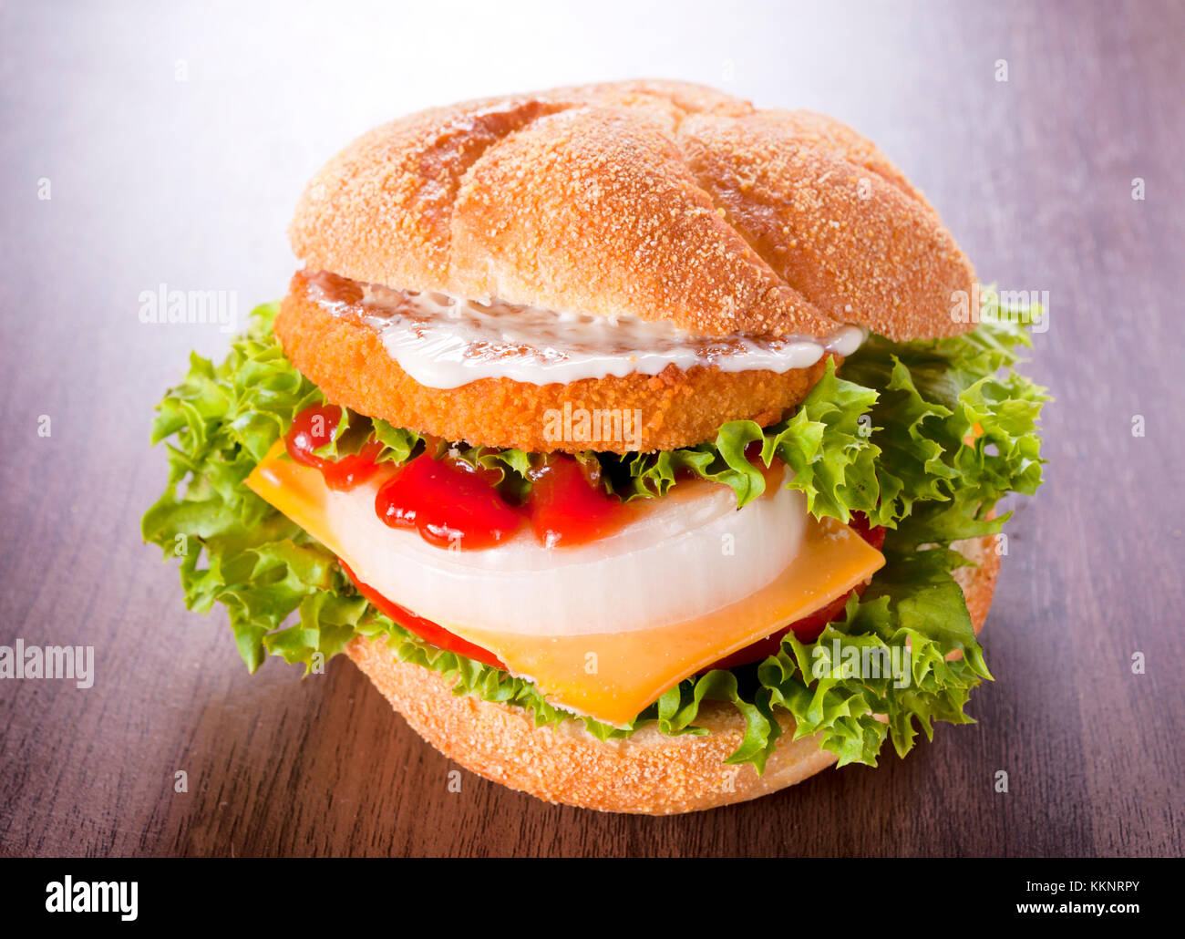 Mayonnaise and ketchup on the tasty fish burger Stock Photo - Alamy