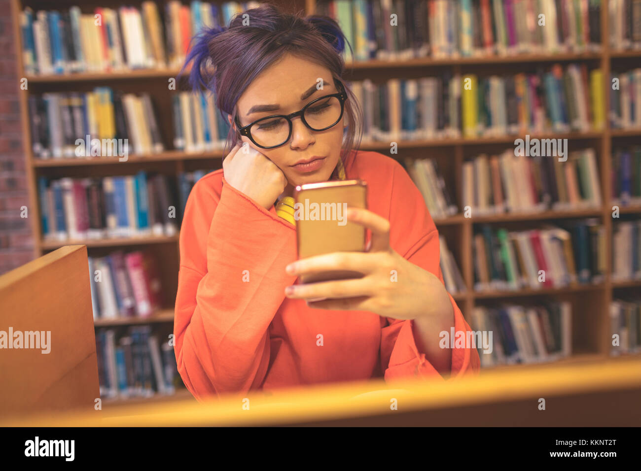 Young girl sitting desk book hi-res stock photography and images - Alamy