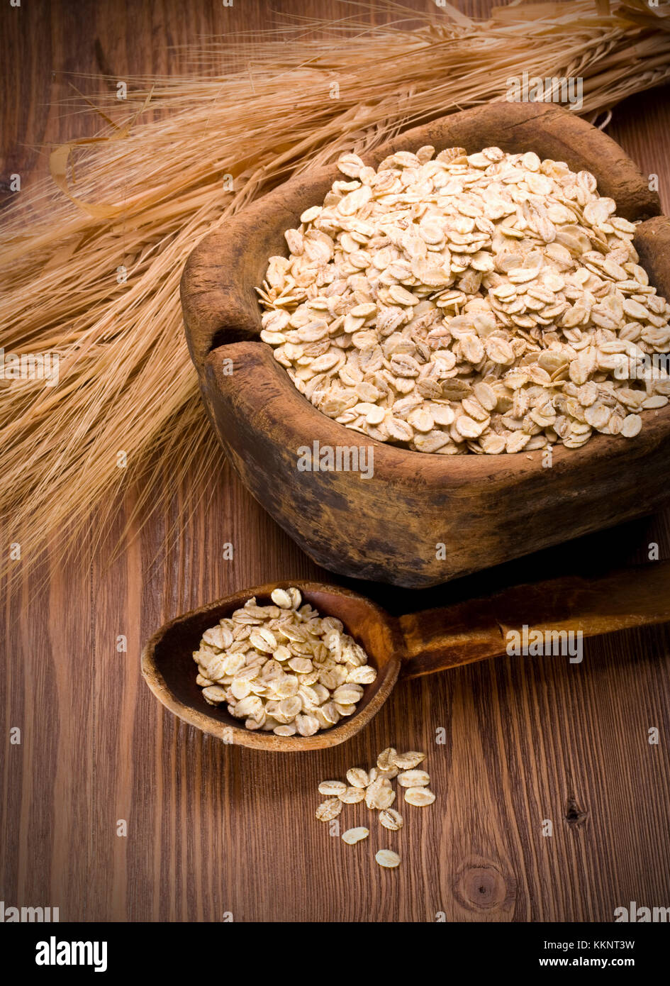 Oatmeal in old wooden spoon Stock Photo - Alamy