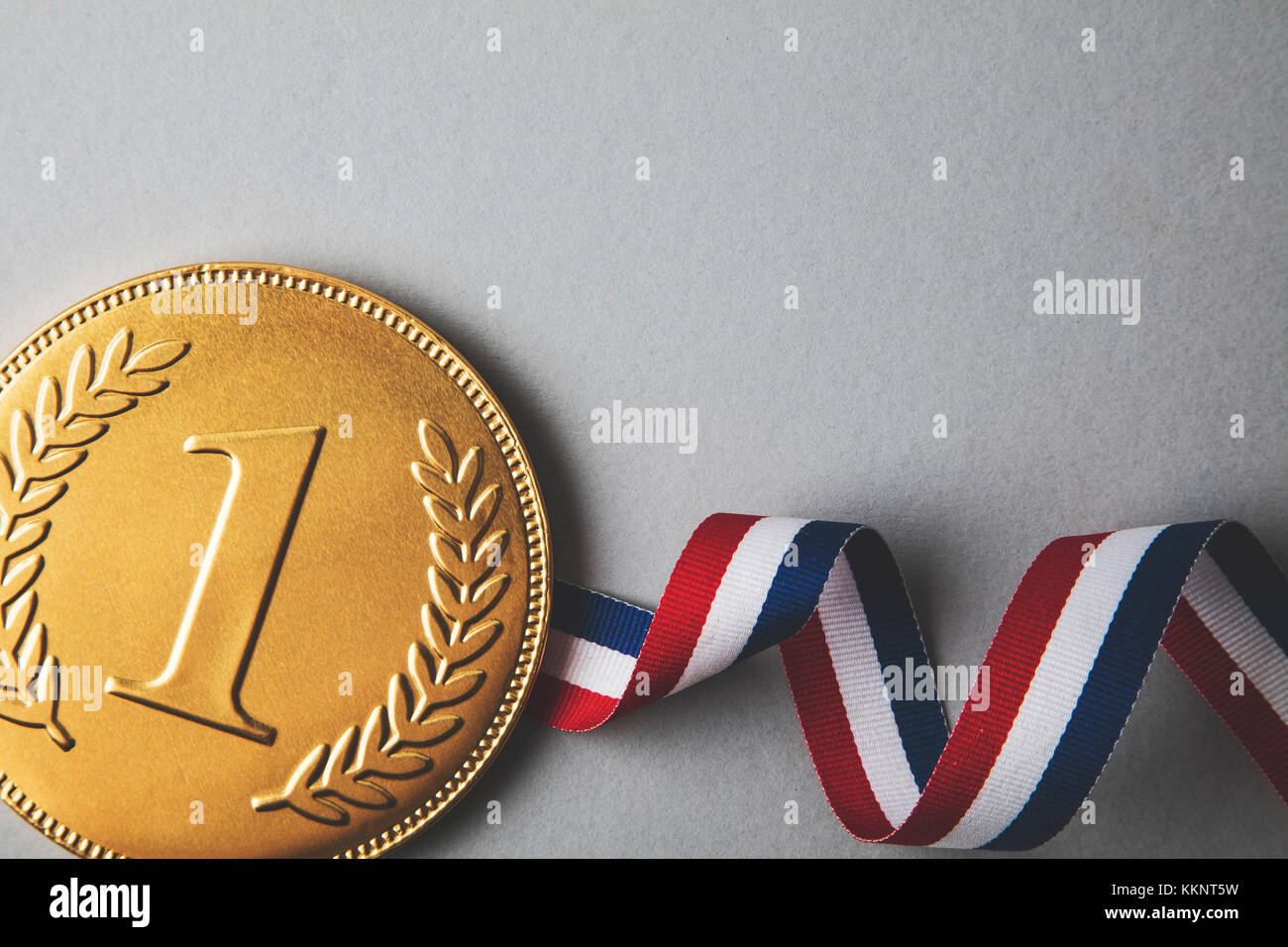 Gold first place winners medal. Success achievement concept Stock Photo ...