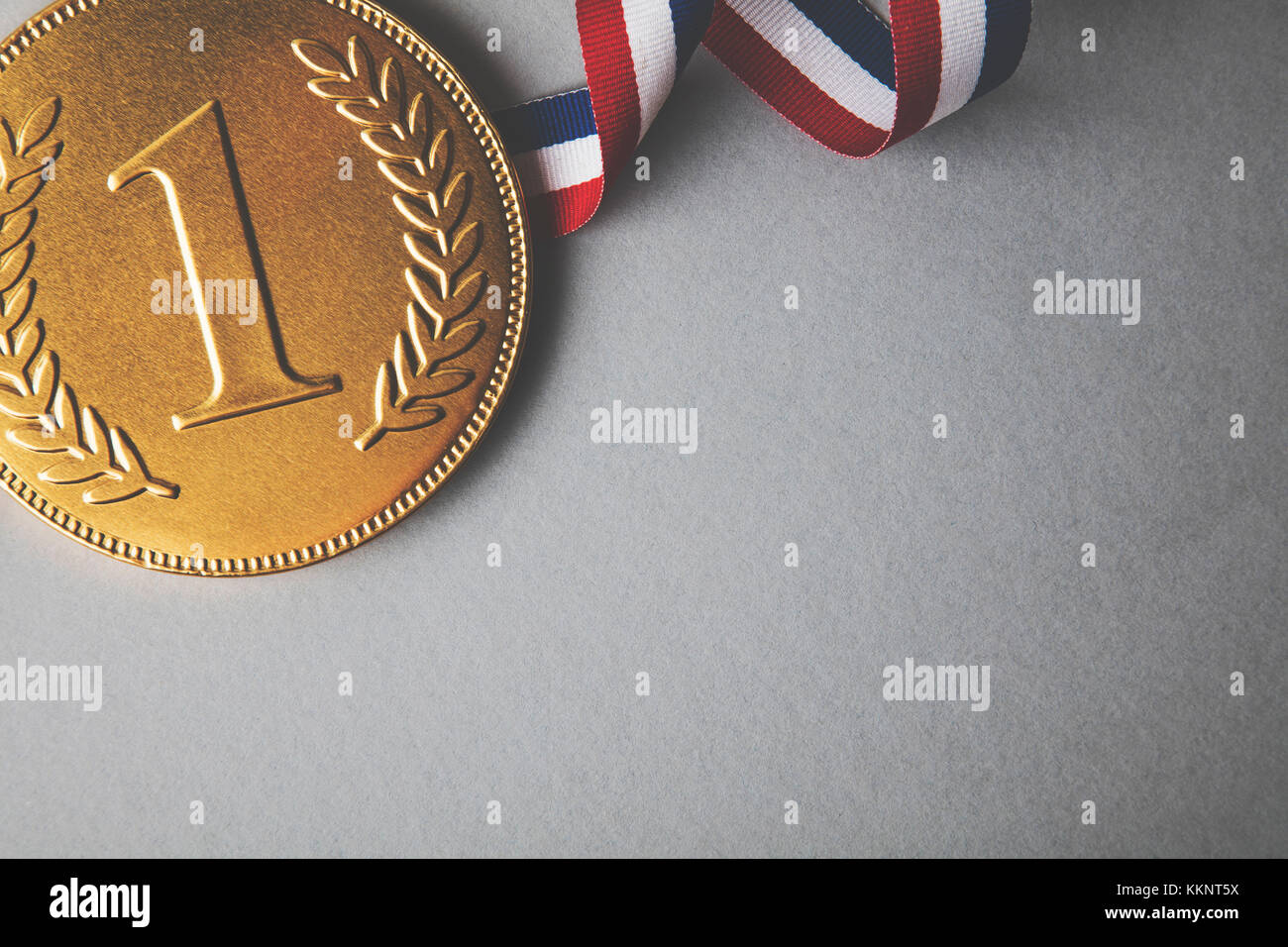Gold first place winners medal. Success achievement concept Stock Photo ...