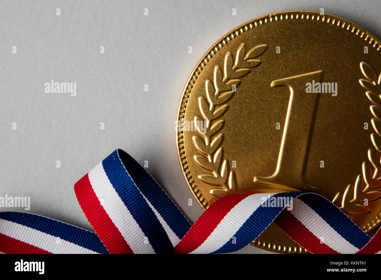 Gold first place winners medal. Success achievement concept Stock Photo ...