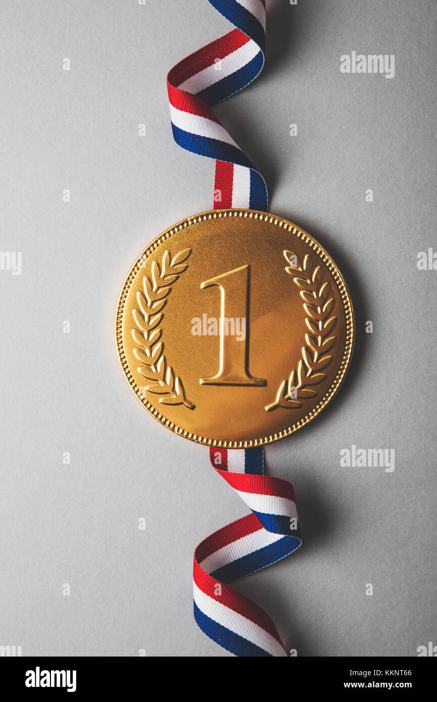 Gold first place winners medal. Success achievement concept Stock Photo ...