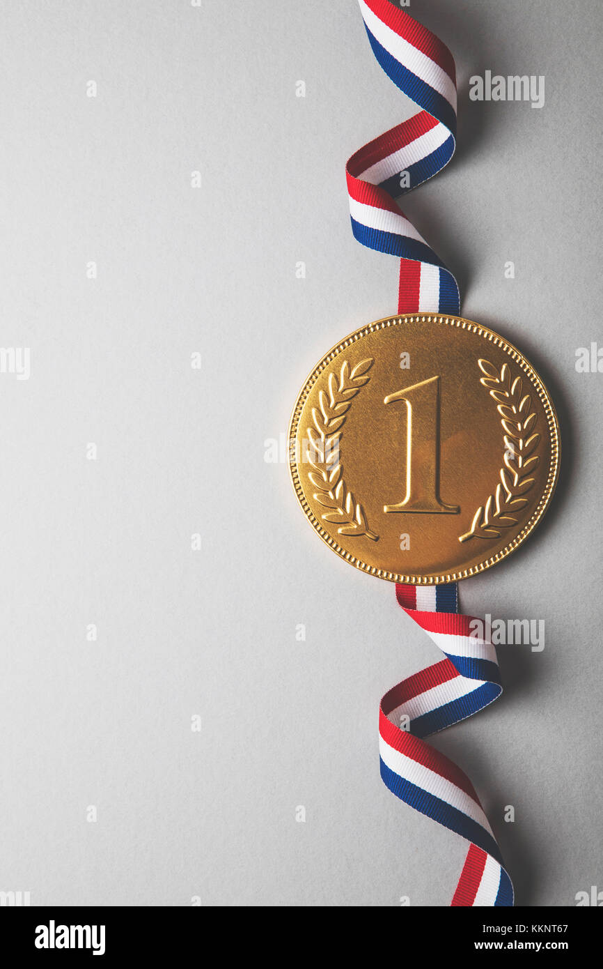 Gold first place winners medal. Success achievement concept Stock Photo ...