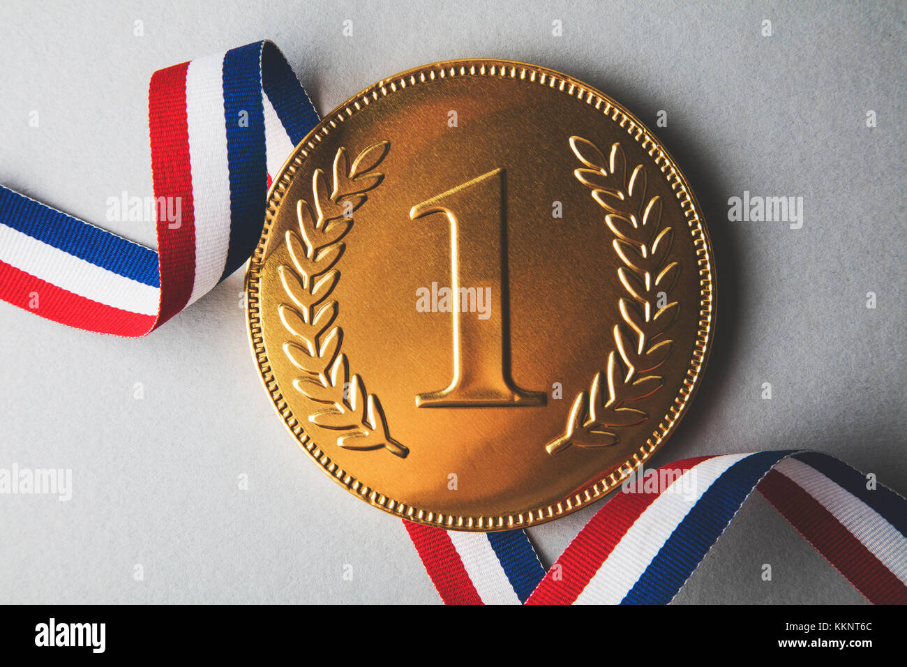 Gold first place winners medal. Success achievement concept Stock Photo ...