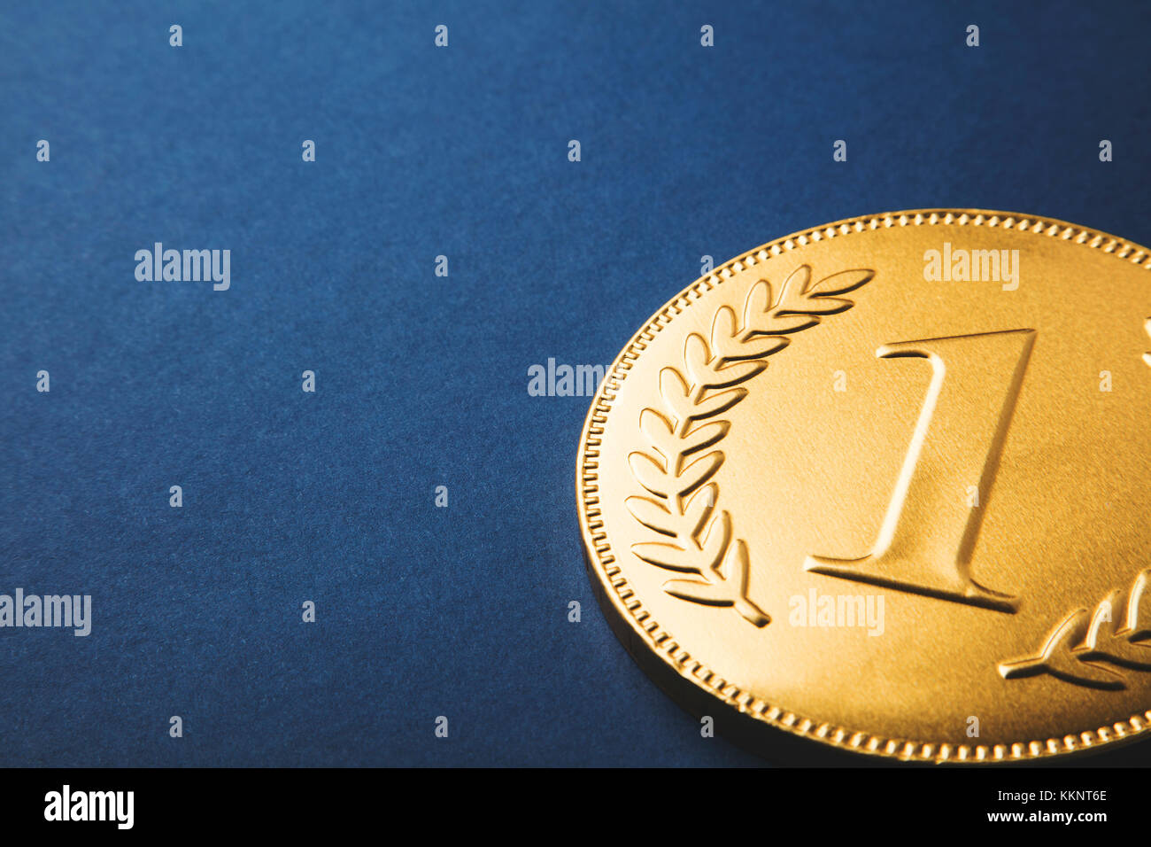 Gold first place winners medal. Success achievement concept Stock Photo ...